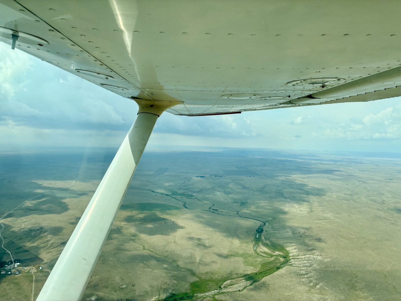 Above the plains, under the clouds - WyoFile